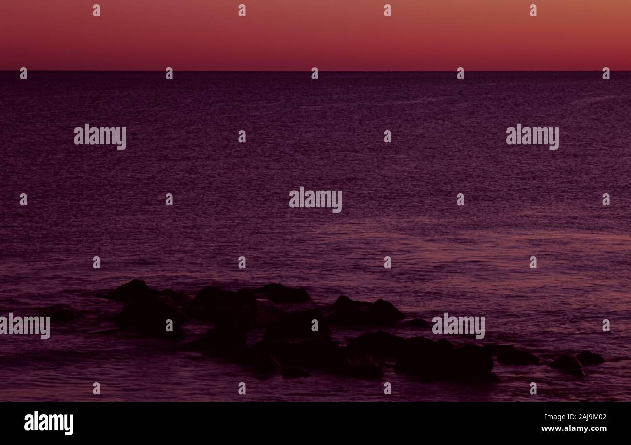 Vivid Red Horizon Over the Sea at Dawn Stock Photo - Alamy
