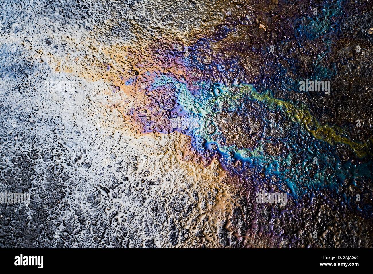 Oil stain on Asphalt road after rain, color Gasoline fuel spots on ...