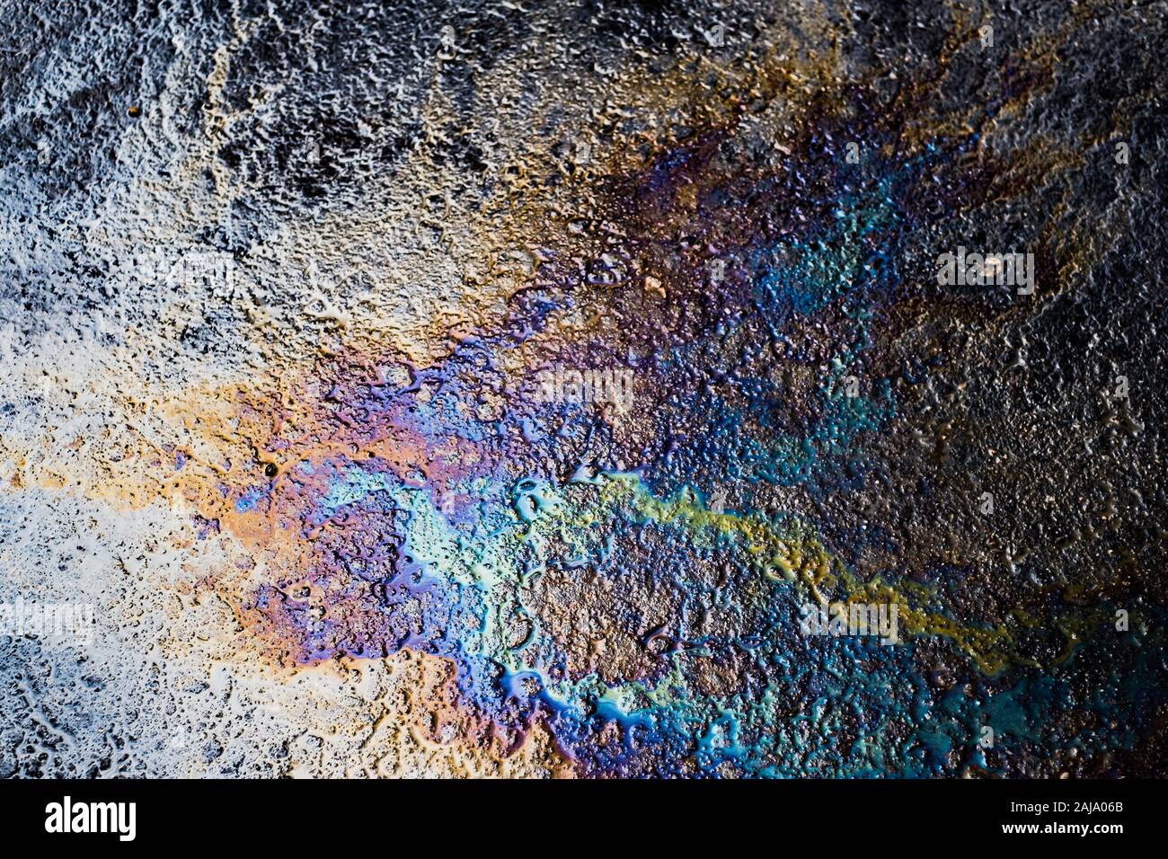 Oil stain on Asphalt road after rain, color Gasoline fuel spots on ...