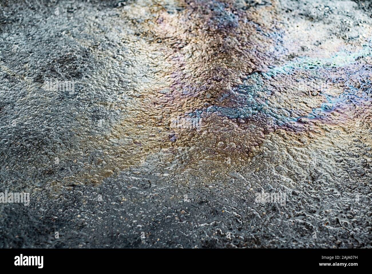 Oil stain on Asphalt road after rain, color Gasoline fuel spots on ...