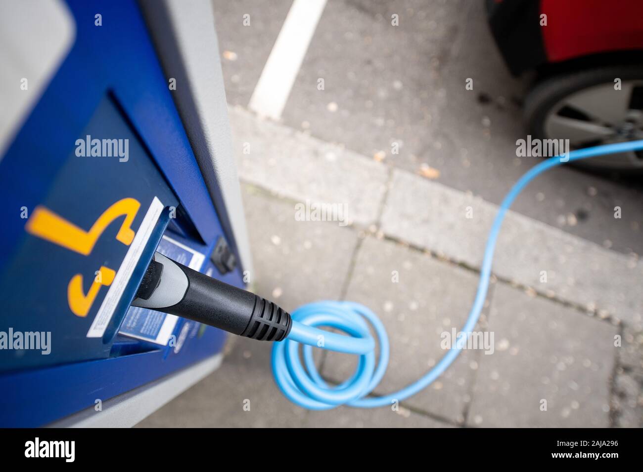 Stuttgart, Germany. 03rd Jan, 2020. A charging plug is plugged into a ...