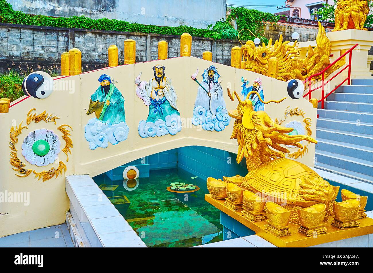 PHUKET, THAILAND - APRIL 30, 2019: The statue of gilt dragon turtle ...