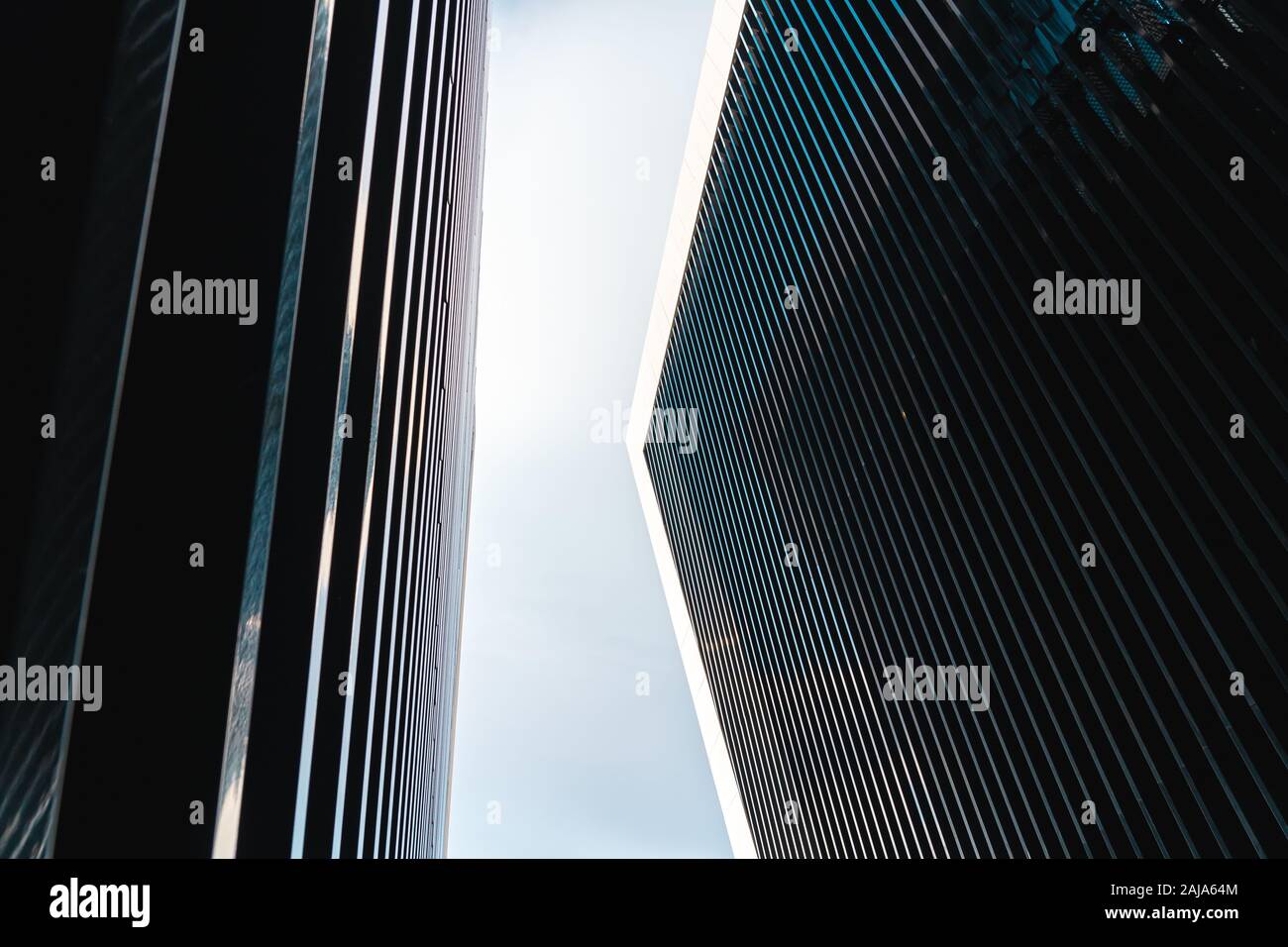 Corners of two contiguous buildings of modern architecture looking up ...
