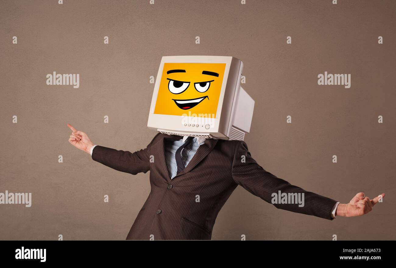 Young person with happy smiley monitor head Stock Photo - Alamy