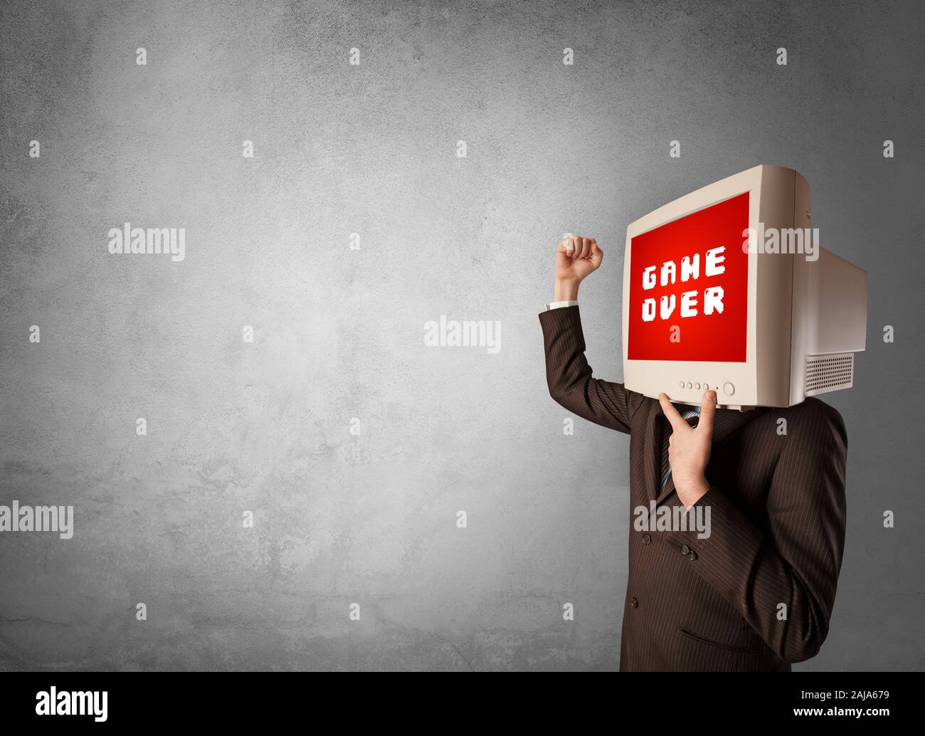 Young person with monitor head, gaming concept Stock Photo - Alamy