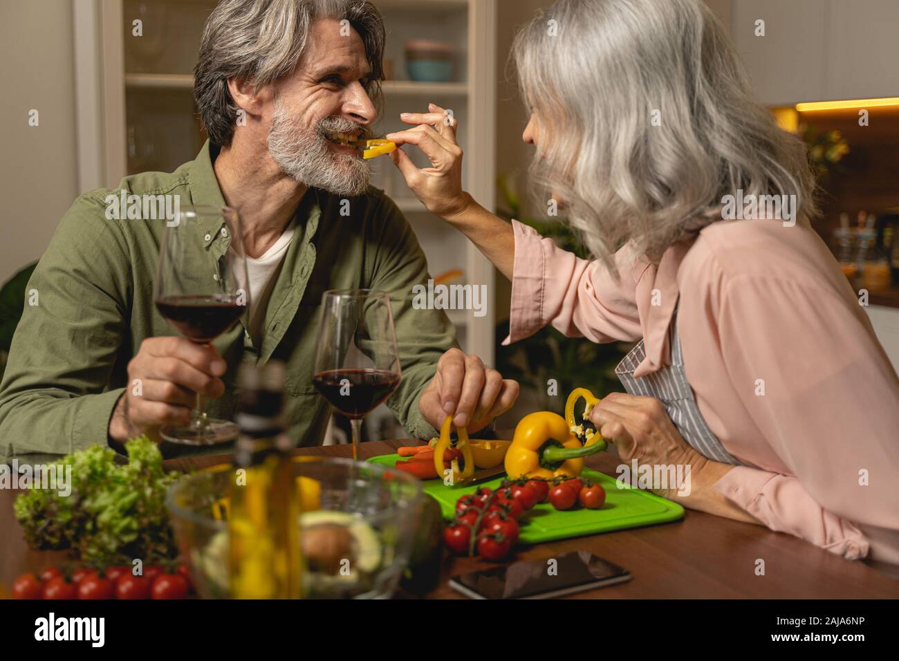 Male eating a slice of bell pepper Stock Photo - Alamy