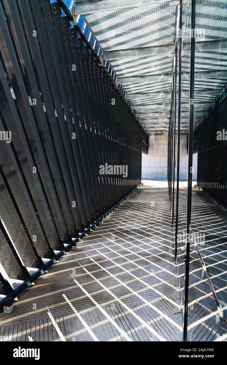 Reflections of the sun entering a corridor of a modern architecture ...