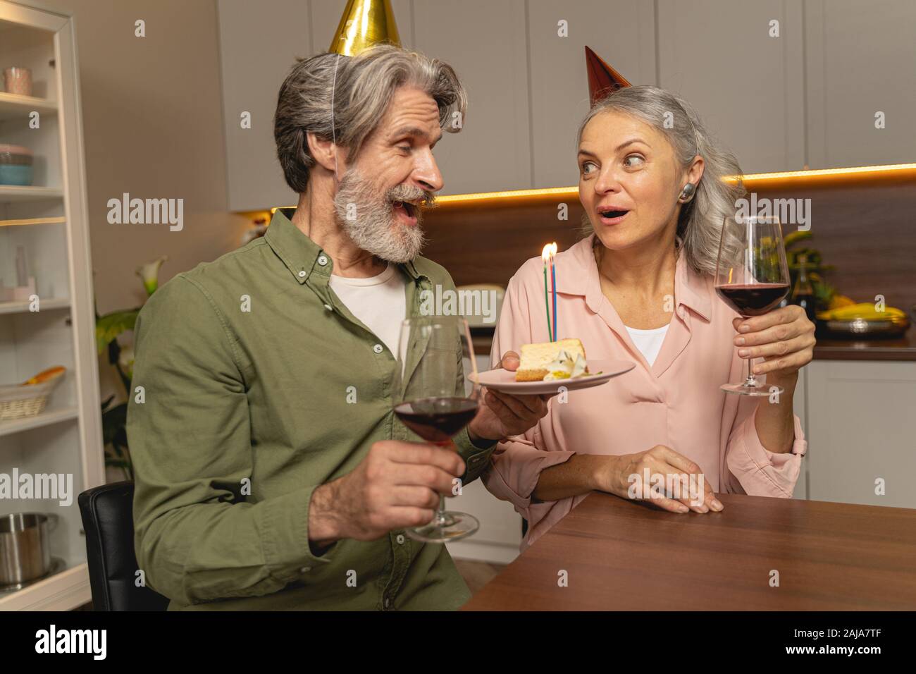Surprised wife gazing at her smiling husband Stock Photo - Alamy