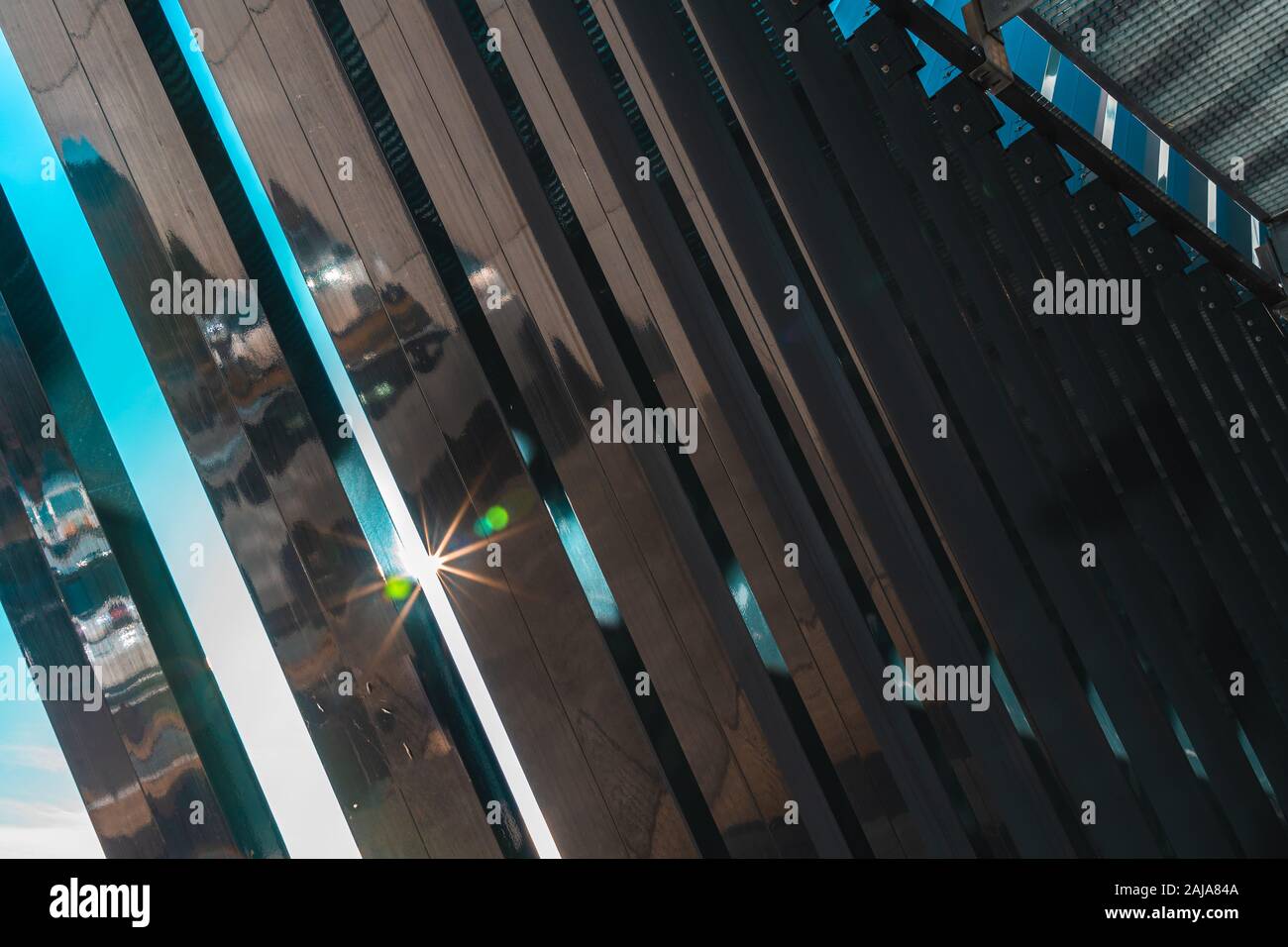 Reflections of the sun entering a corridor of a modern architecture ...