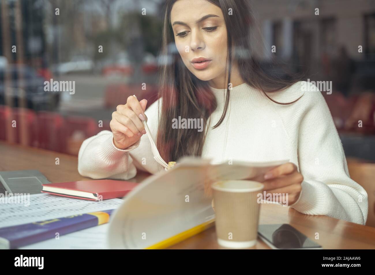 Serious student reading task before test paper Stock Photo - Alamy