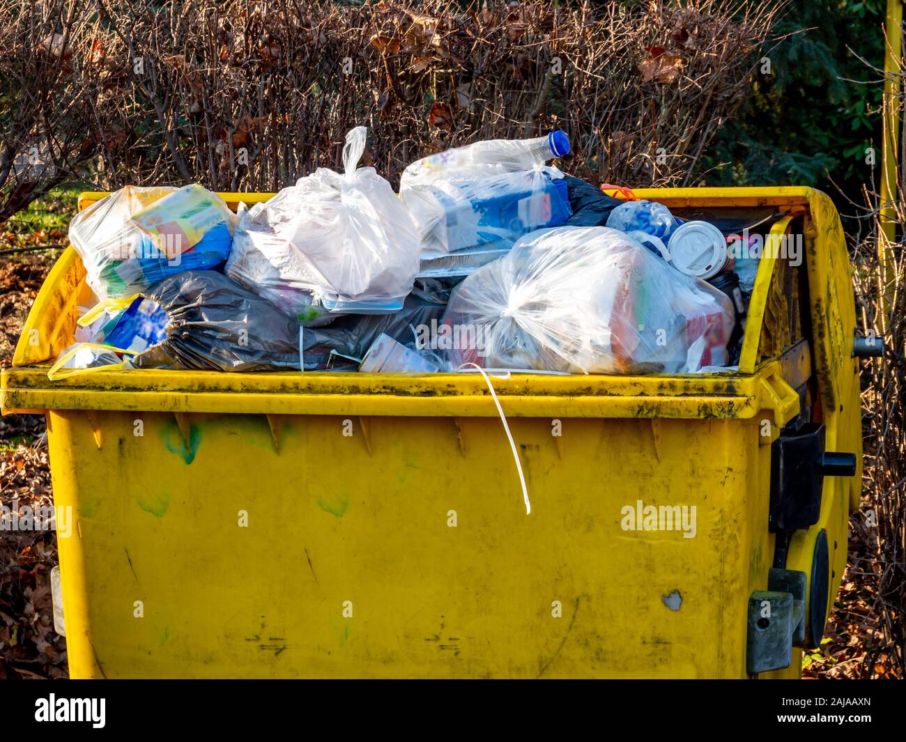 Yellow bin with plastic waste Stock Photo - Alamy