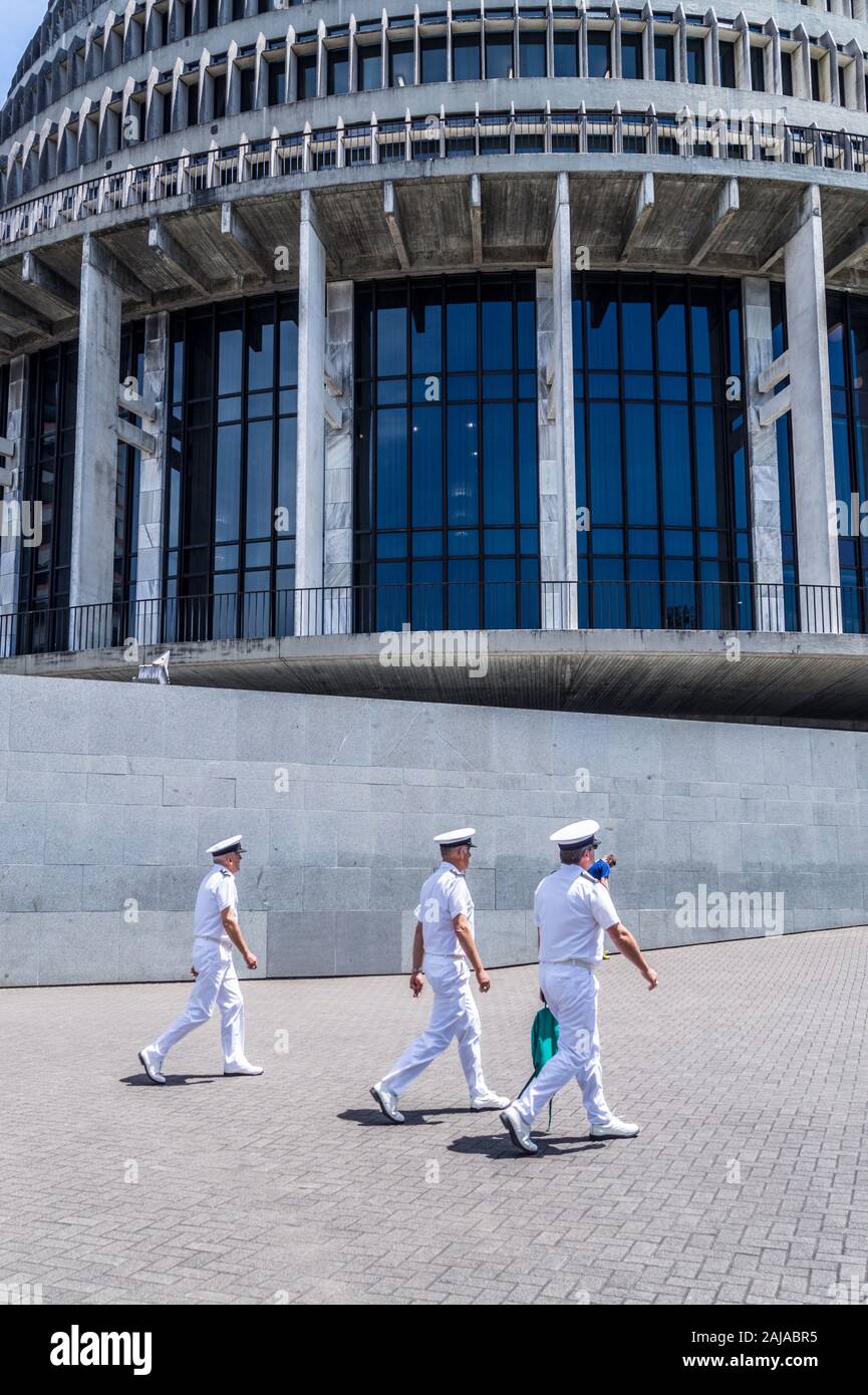 A group of three military officers walking in front of "The Beehive ...