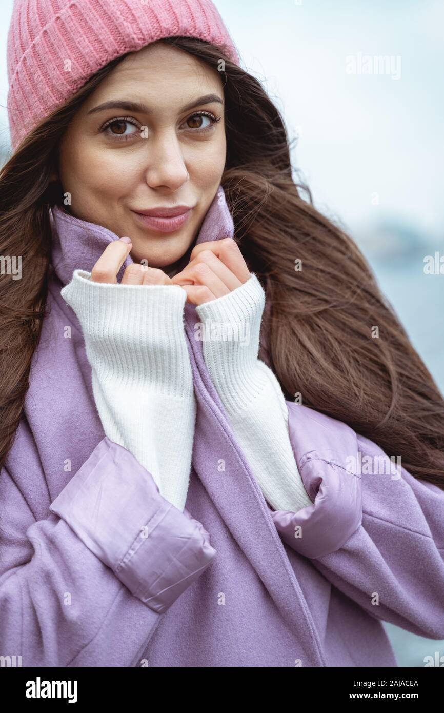 Portrait of cute girl that covering her neck Stock Photo - Alamy
