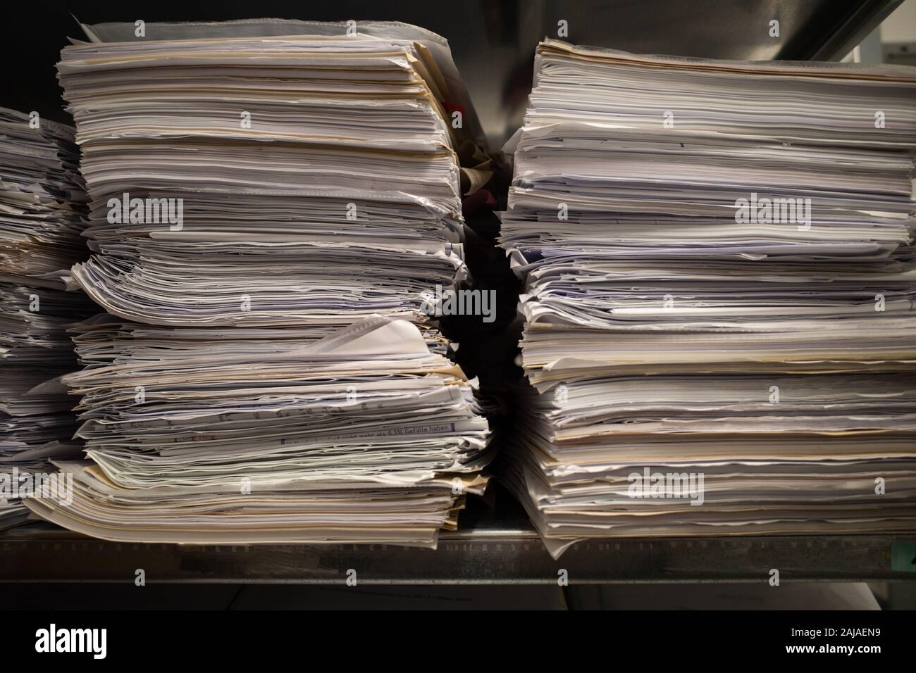 in a file archive there are shelves filled with mountains of files ...