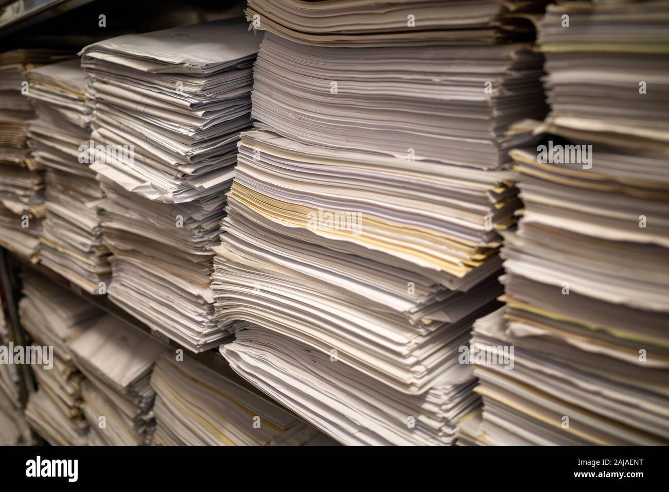 in a file archive there are shelves filled with mountains of files ...