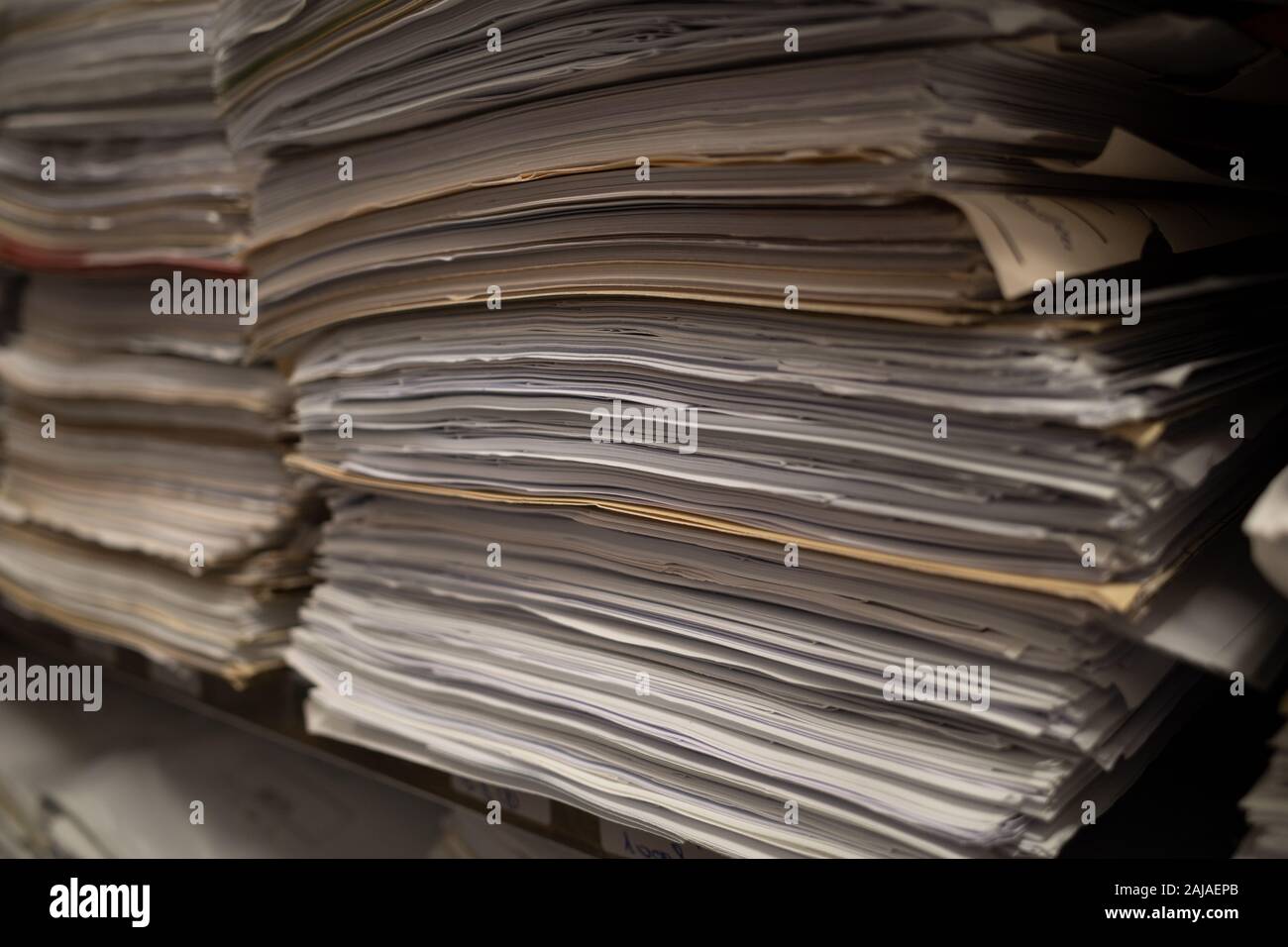 in a file archive there are shelves filled with mountains of files ...