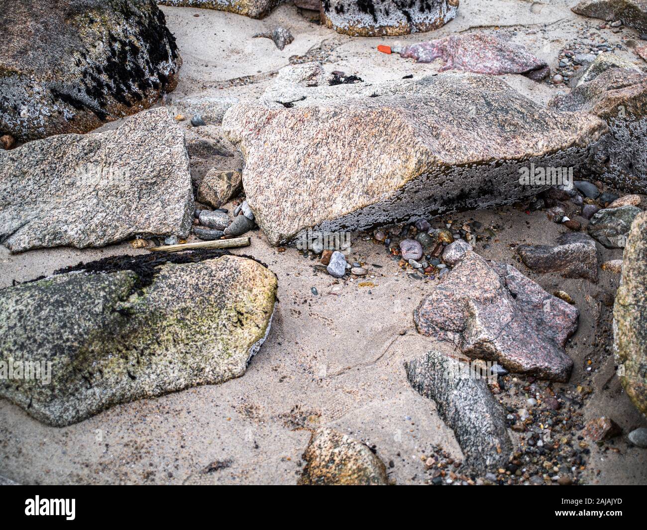 Rocks Pebbles and Sand at Low Tide on the Beach Stock Photo - Alamy