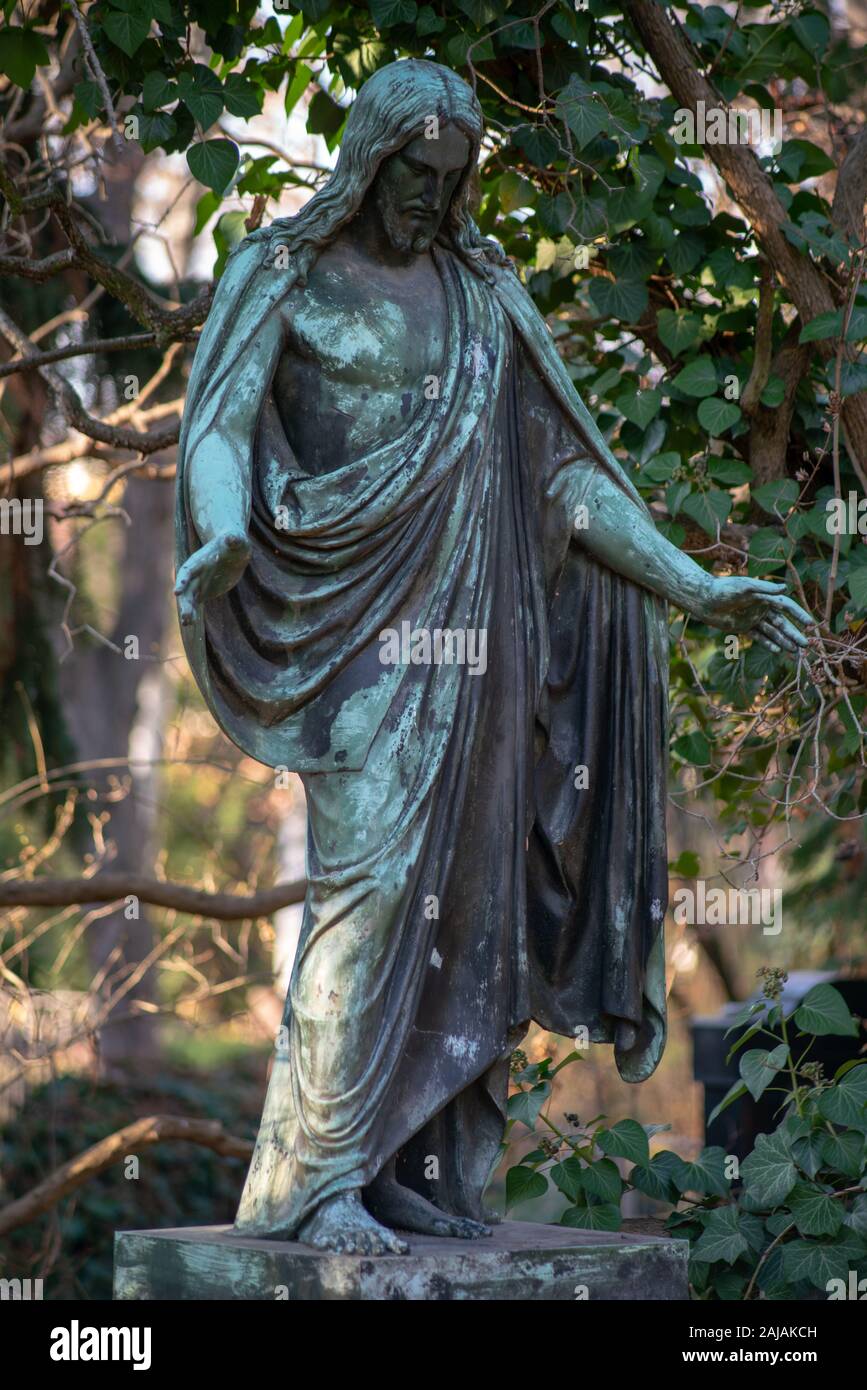 Sculpture of Jesus Christ on a grave on a german graveyard in Berlin ...