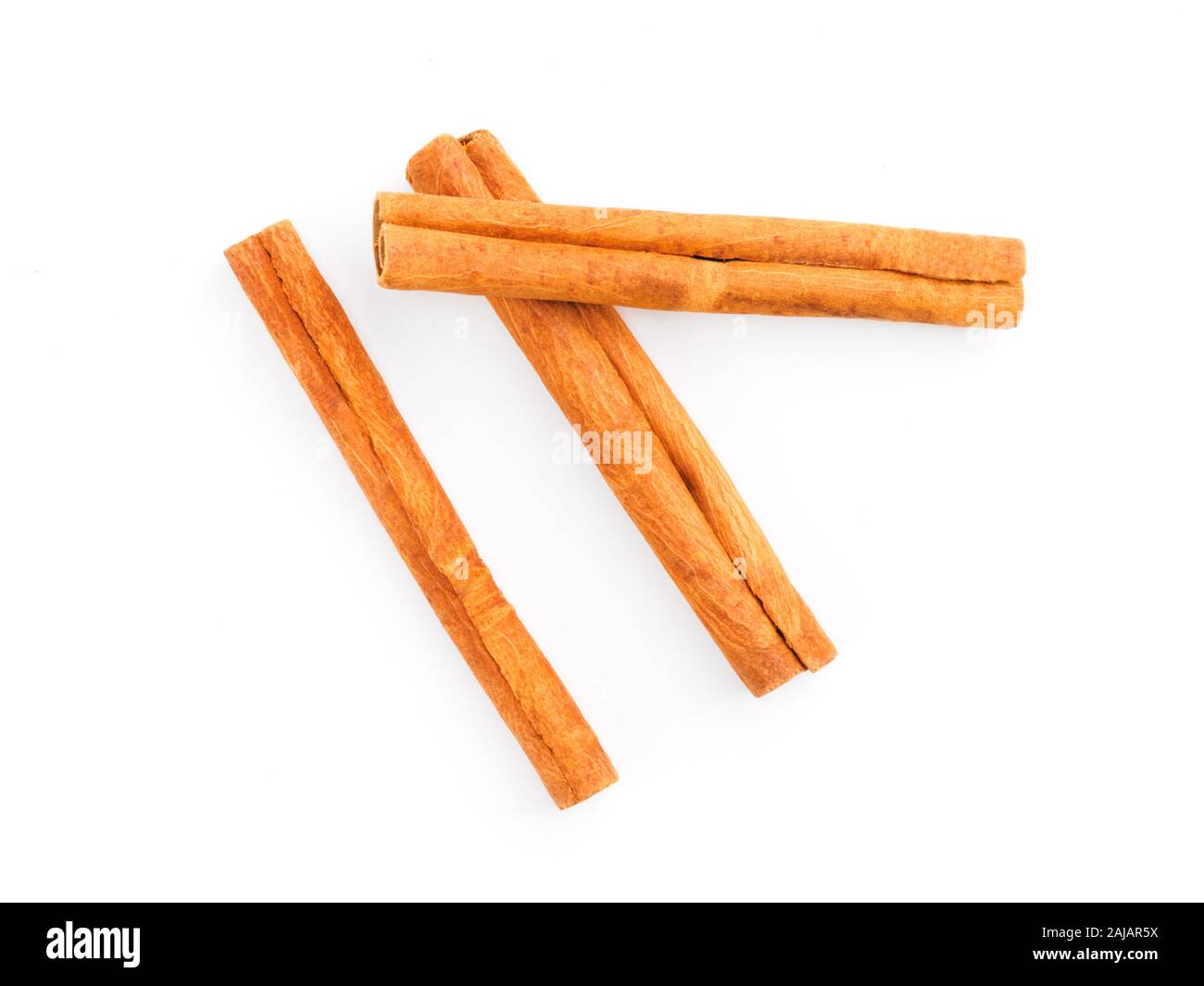 Three sticks of spice cinnamon on white isolated background. Indian ...
