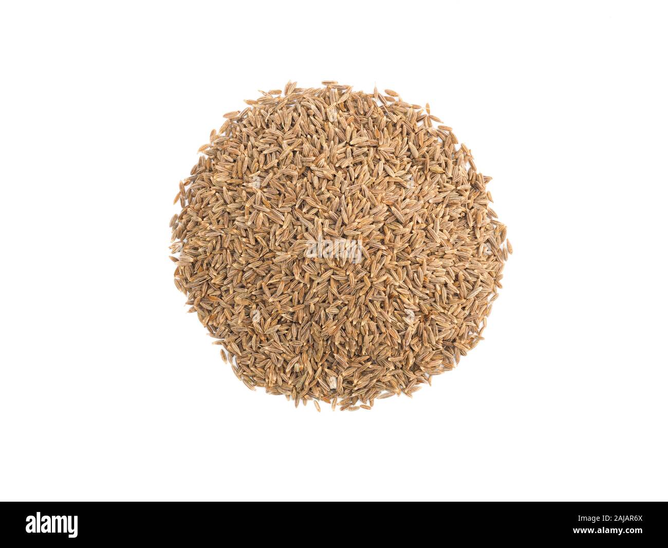 A round bunch of cumin (jeera) on white isolated background. Indian ...