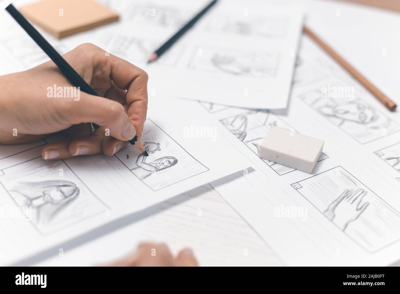 Woman's hand draws a storyboard for a film or cartoon Stock Photo - Alamy