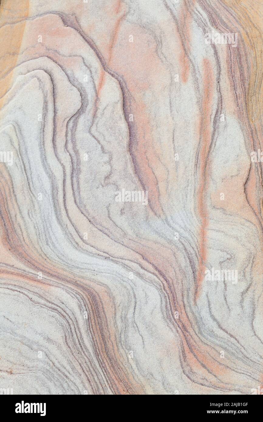 Abstract patterns, shapes and lines in the soft pastel coloured rocks ...