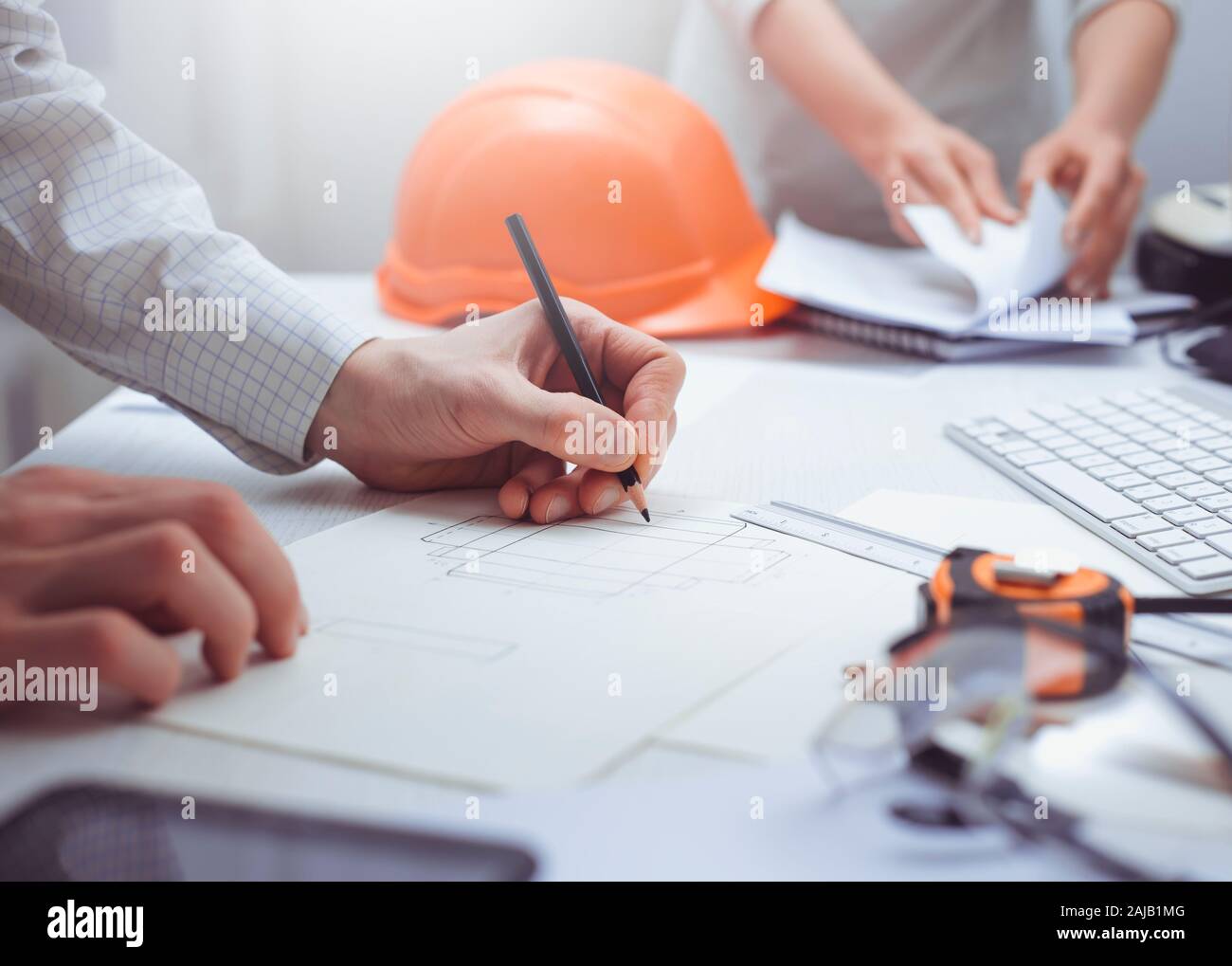 A team of architects develop a drawing for construction projects ...