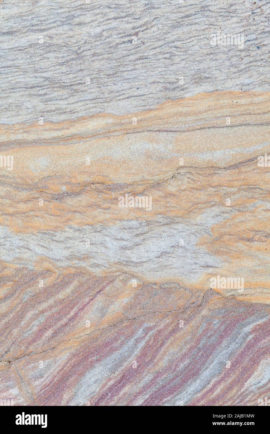 Abstract patterns, shapes and lines in the soft pastel coloured rocks ...