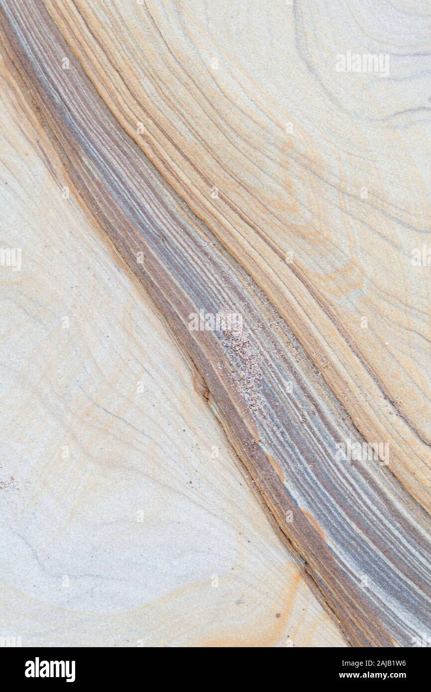 Abstract patterns, shapes and lines in the soft pastel coloured rocks ...