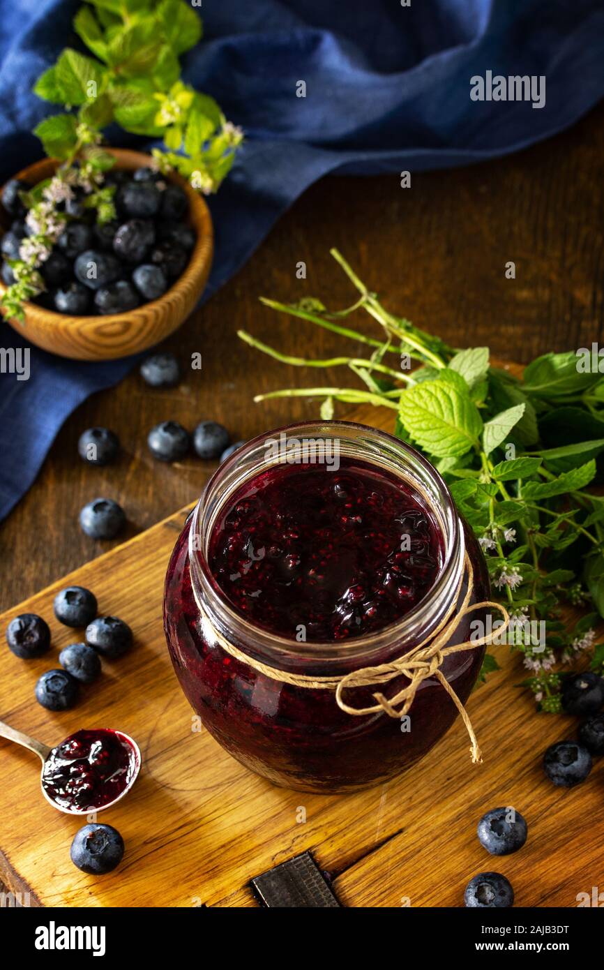 Organic Homemade Preserves. Blueberry jam in a jar and fresh ...