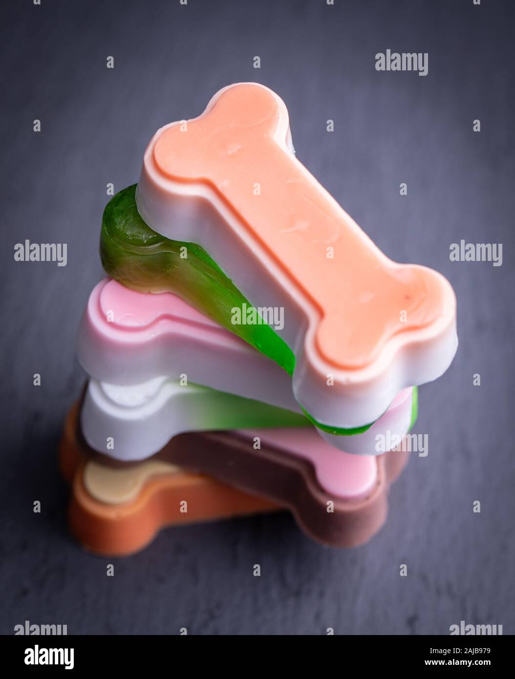Cute colored bones on dark dark background Stock Photo - Alamy