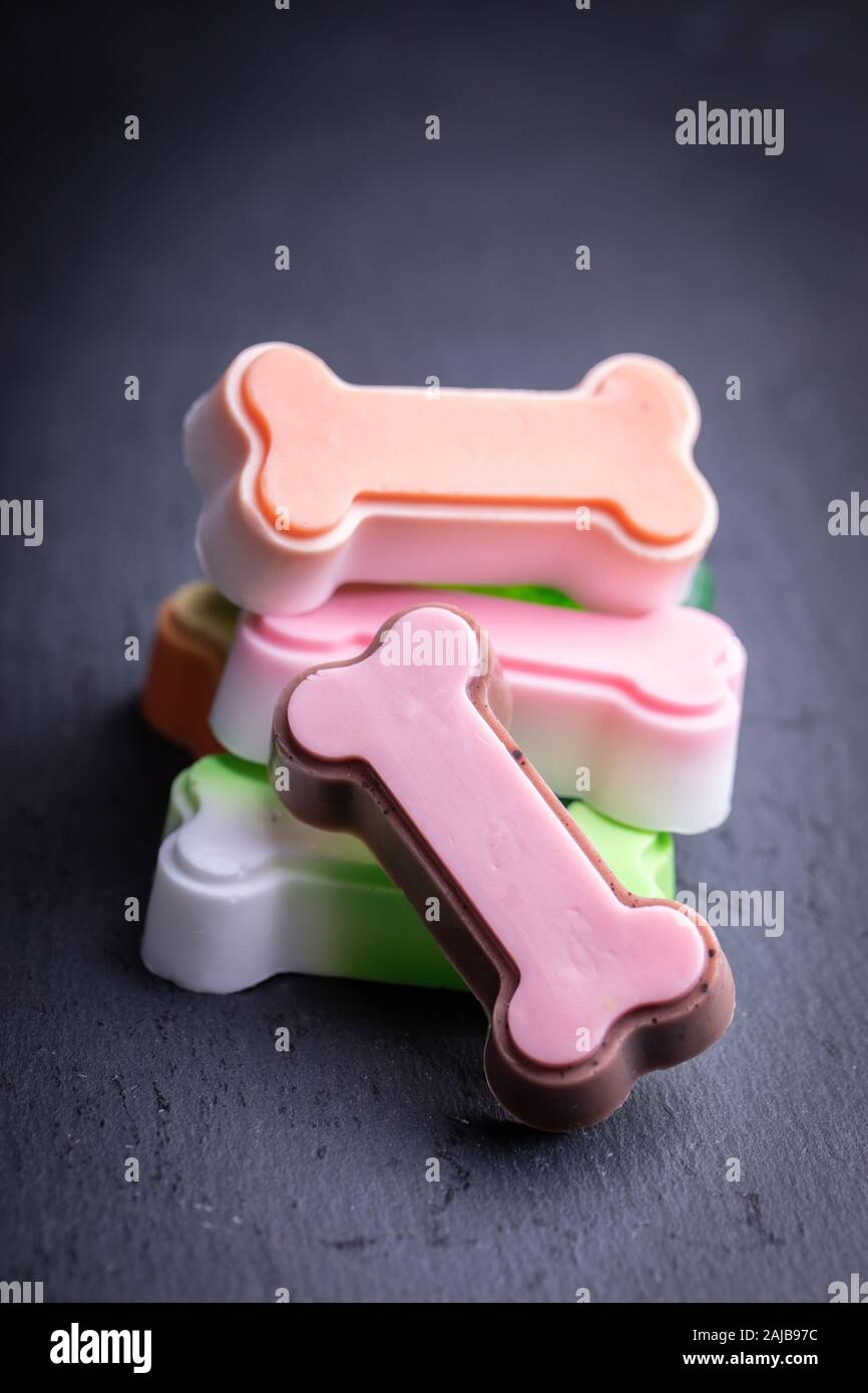 Cute colored bones on dark dark background Stock Photo - Alamy