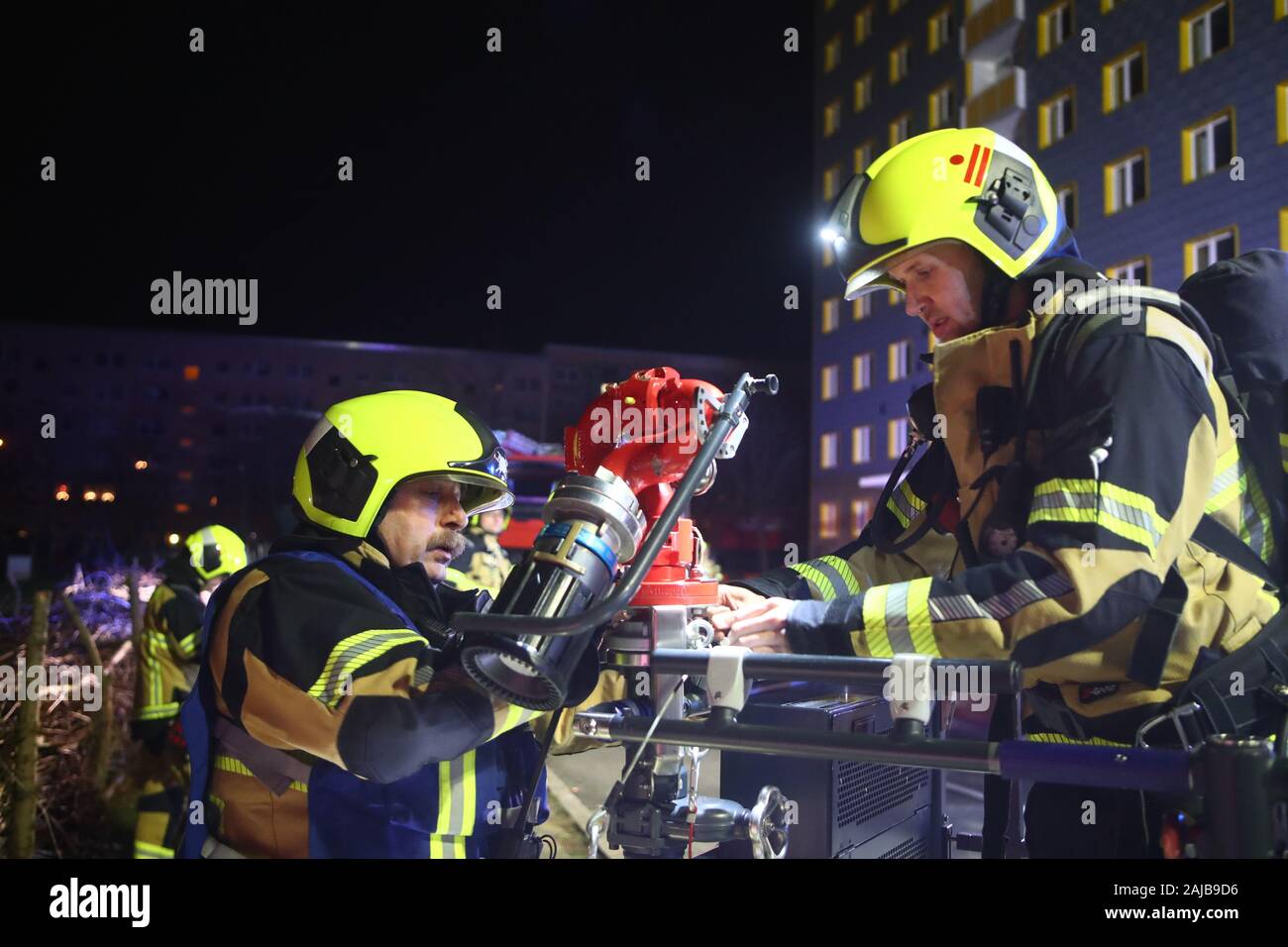 Gera, Germany. 02nd Jan, 2020. Firefighters prepare extinguishing ...