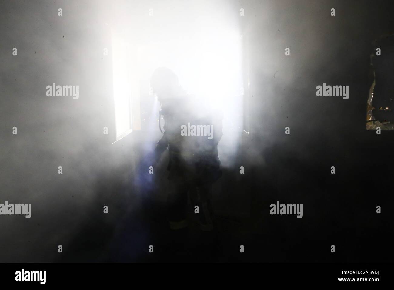 Gera, Germany. 02nd Jan, 2020. Firefighters extinguish a fire in a ...