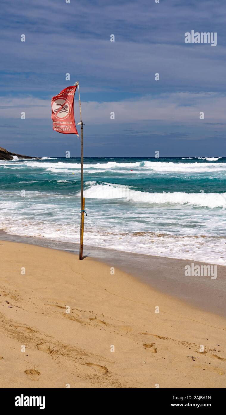 Beach with red no swimming flag Stock Photo - Alamy