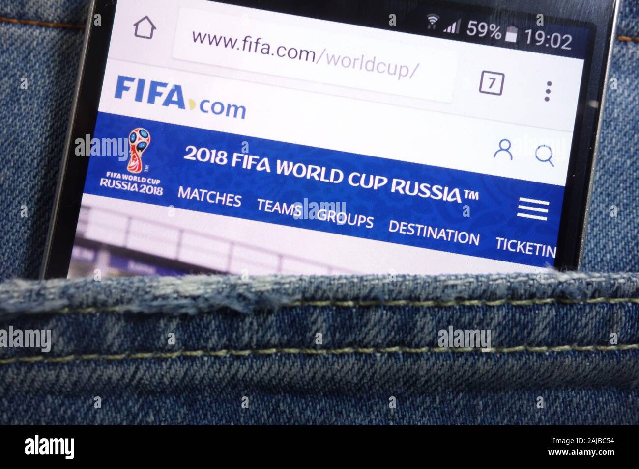 Fifa website displayed on smartphone hidden in jeans pocket Stock Photo ...