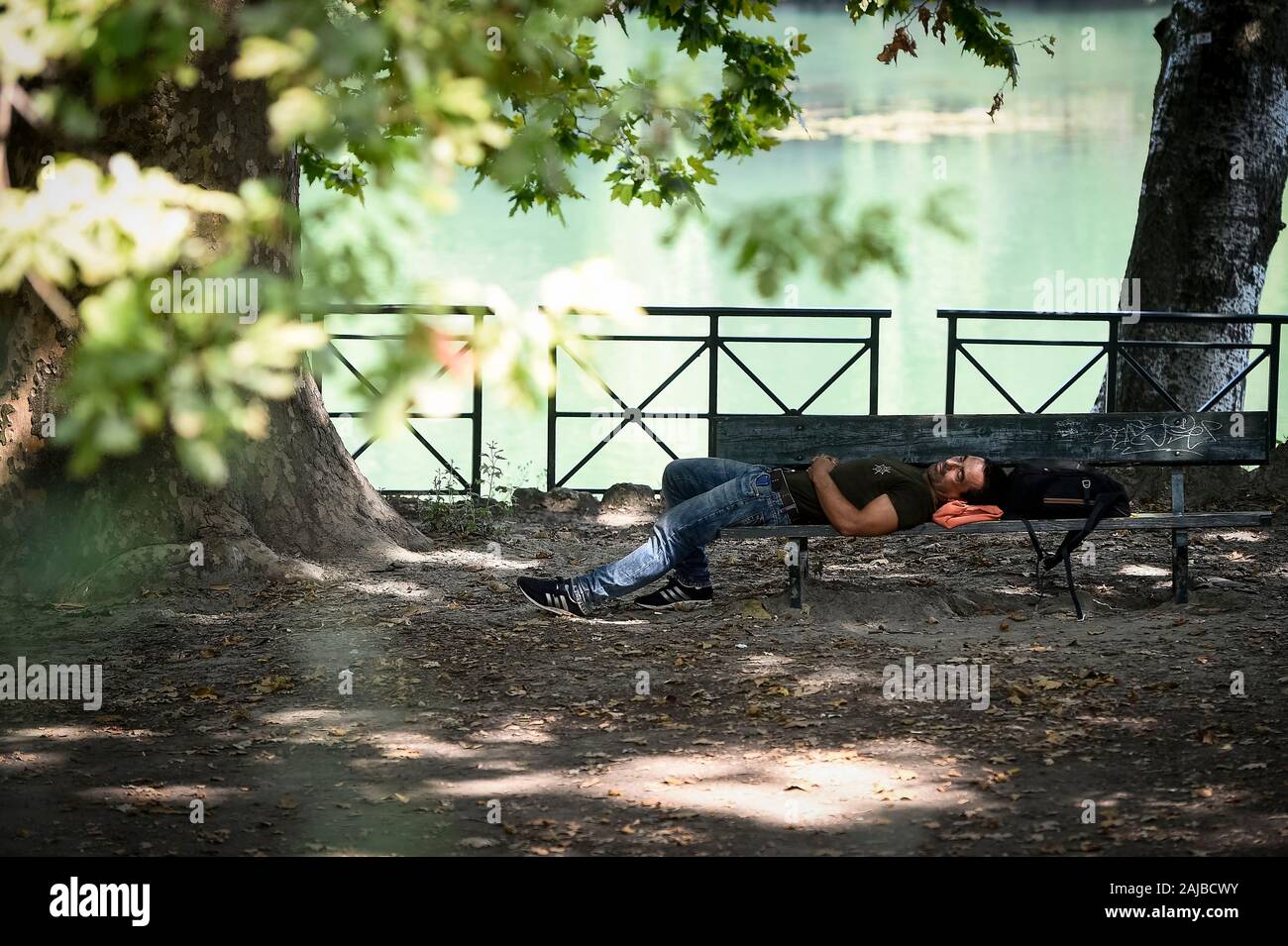 Man sleeping under tree hi-res stock photography and images - Alamy