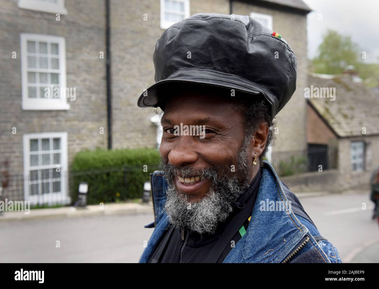 Happy smiling Rastafarian man Stock Photo - Alamy