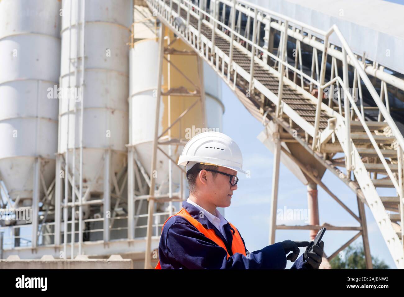 concrete worker with helmet in concrete factory Stock Photo - Alamy