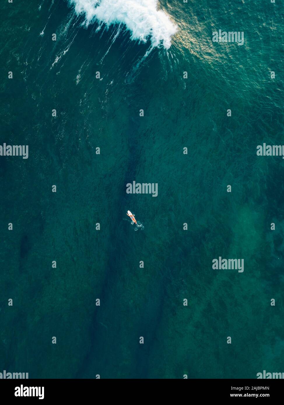 Aerial view of surfer in the ocean Stock Photo - Alamy