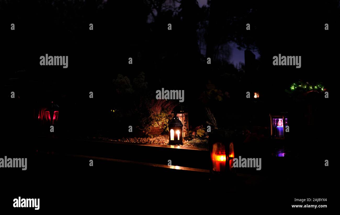 Landern illuminated graves in the night on the west cemetery in Aachen ...