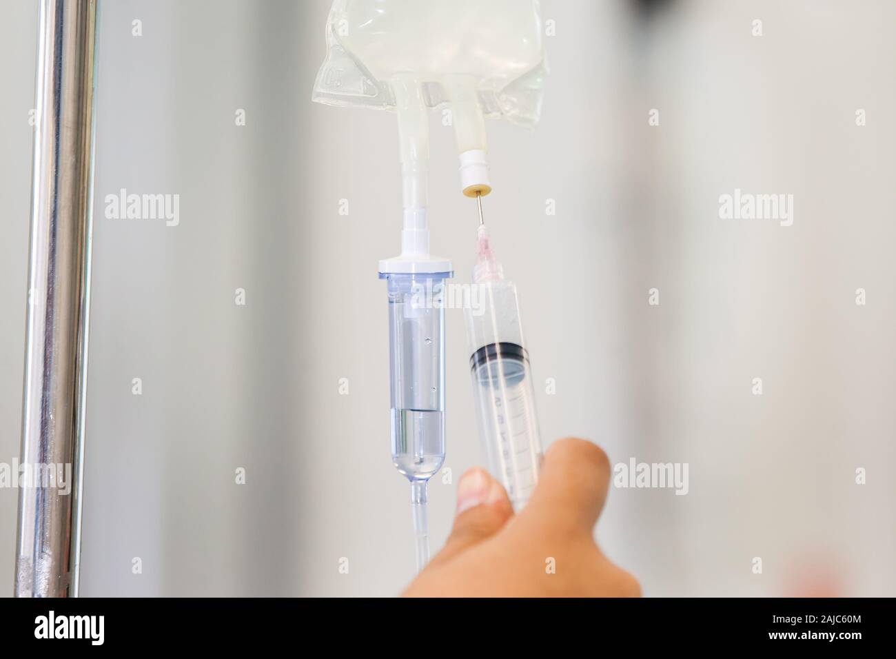 Nurse injecting drug through hi-res stock photography and images - Alamy