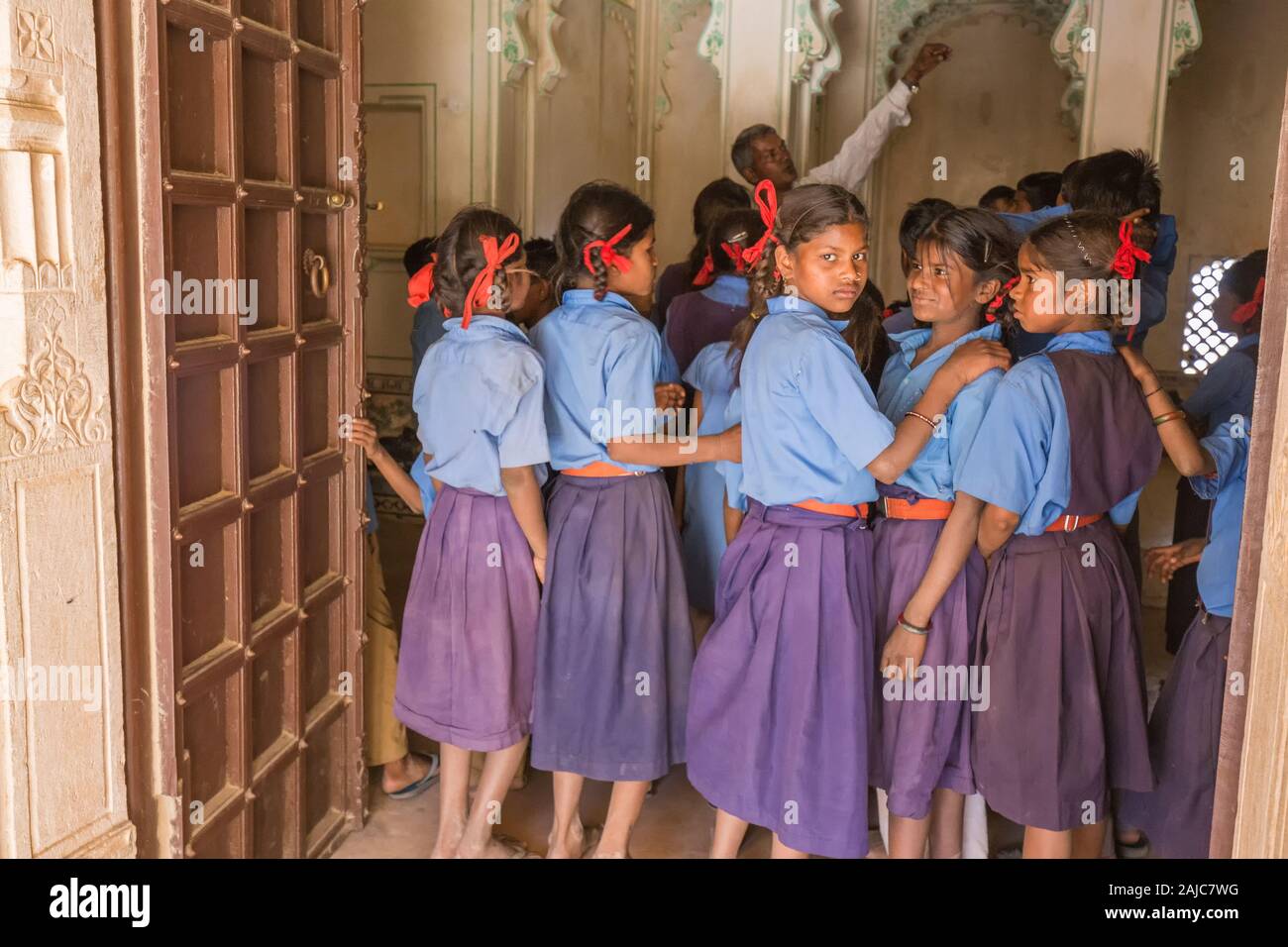 Teacher watching children uniform hi-res stock photography and images ...