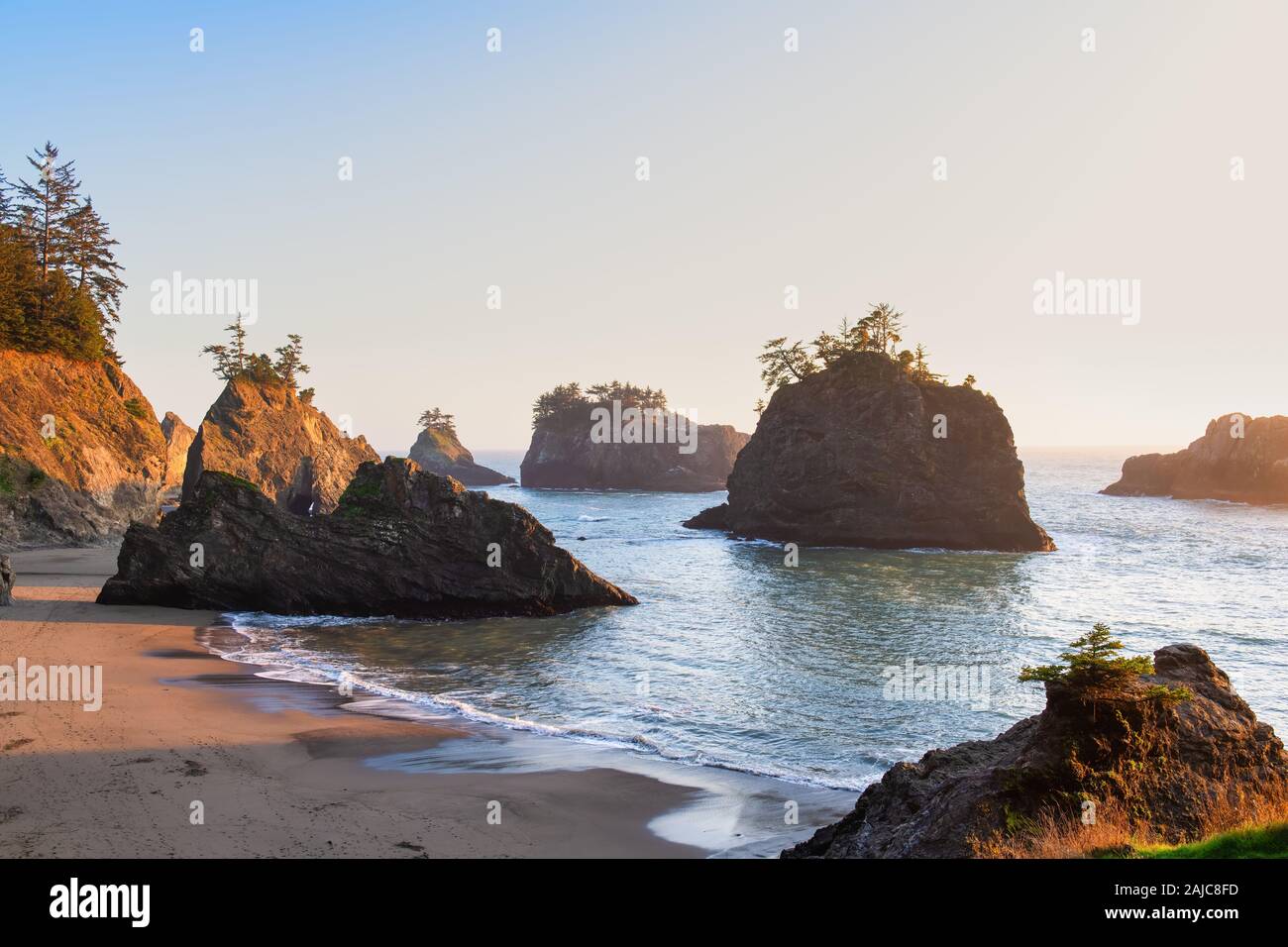Sea stacks at Secret Beach during Golden Hour Stock Photo - Alamy