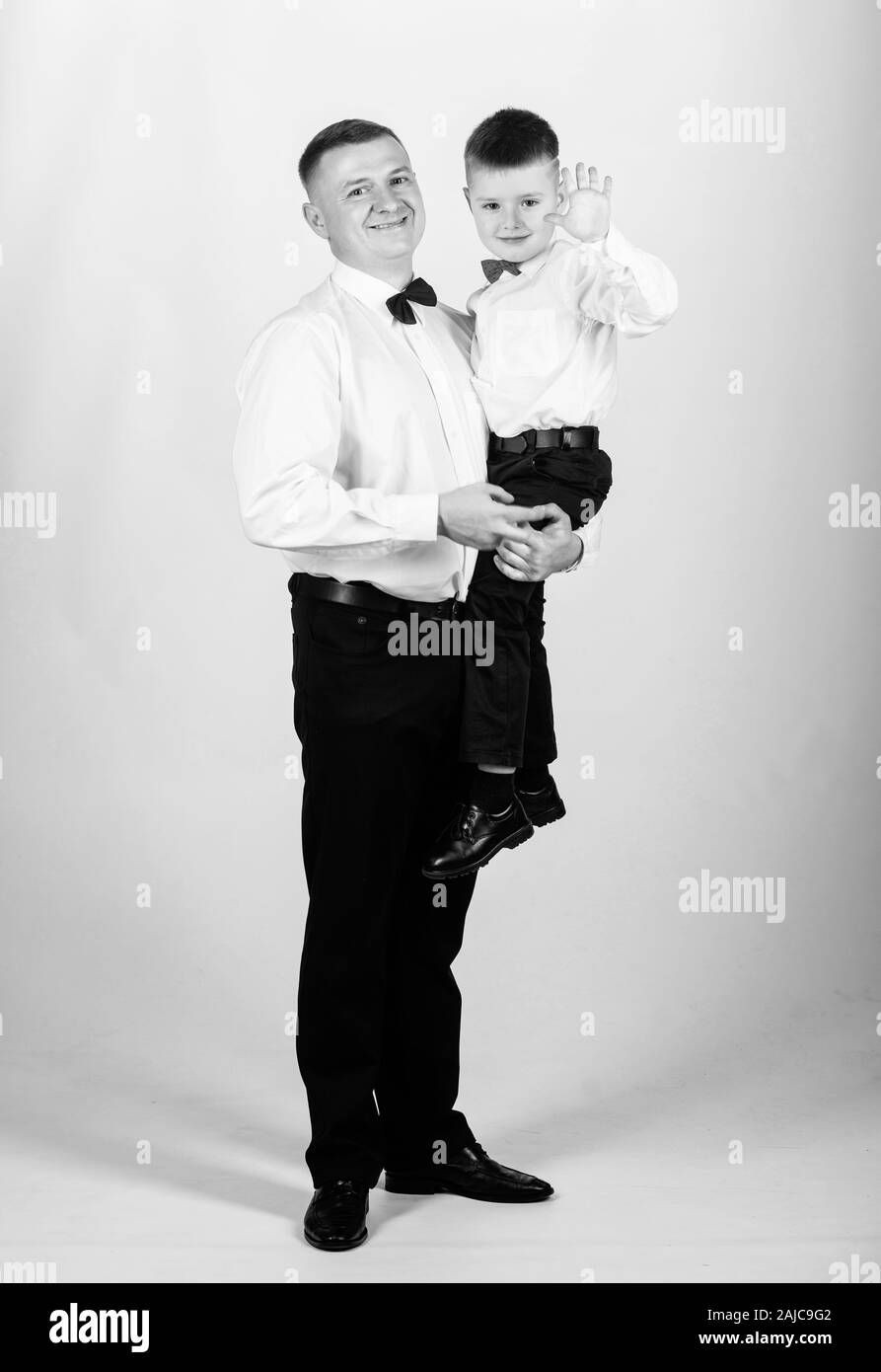 Father carry hug son formal clothes outfit. Grow up gentleman ...