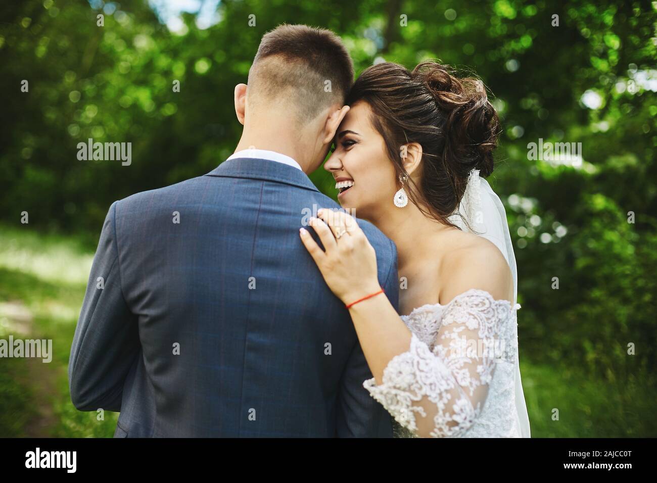 Happy plus size model woman with stylish wedding hairstyle in a ...