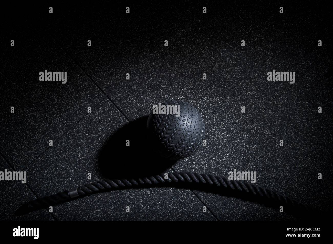 Black rope and a medicine ball. Sports equipment for workout with free ...