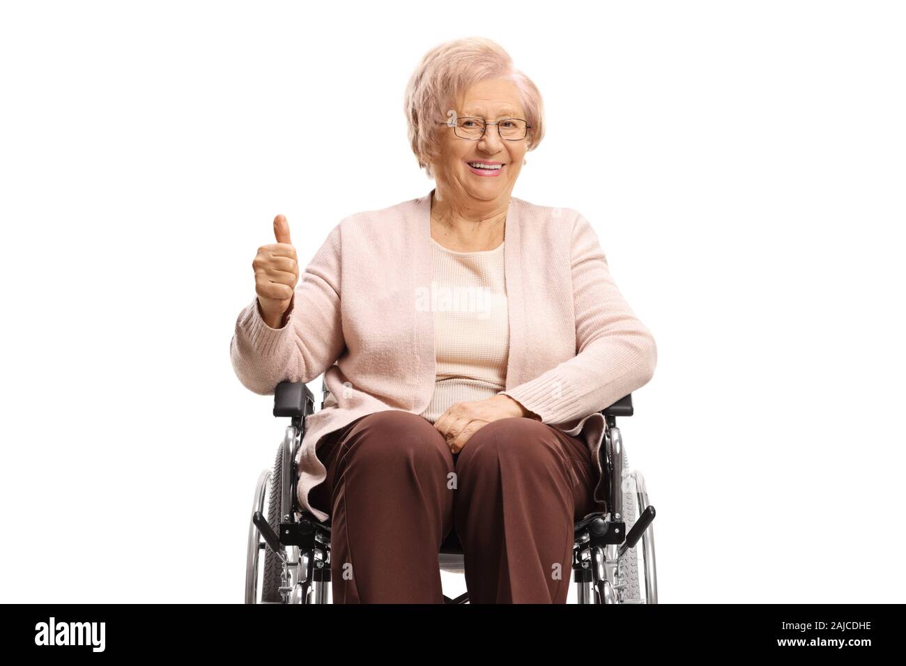 Disabled elderly woman in a wheelchair and smiling at the camera with ...