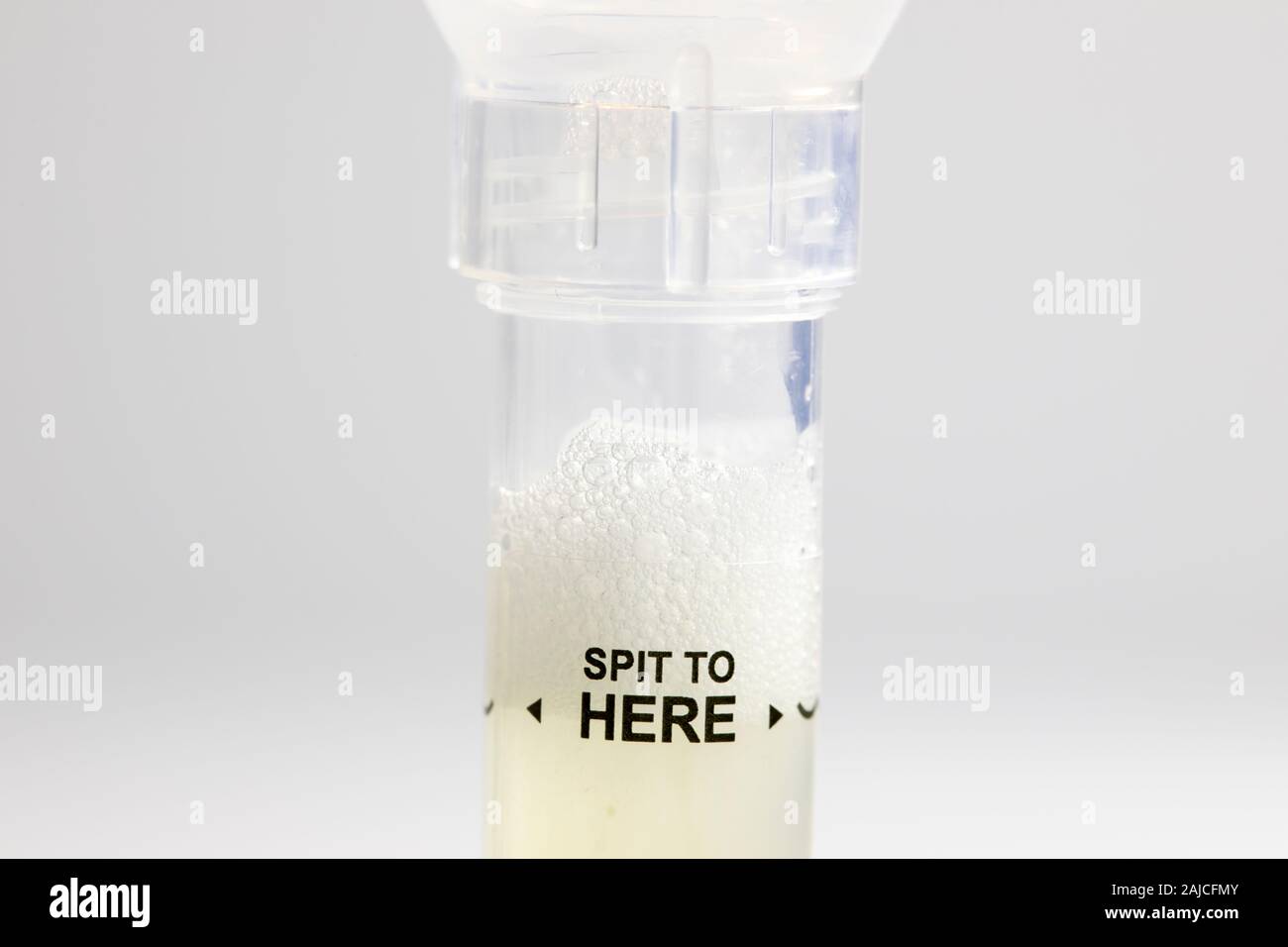 Close up of plastic saliva collection tube used in DNA testing Stock ...