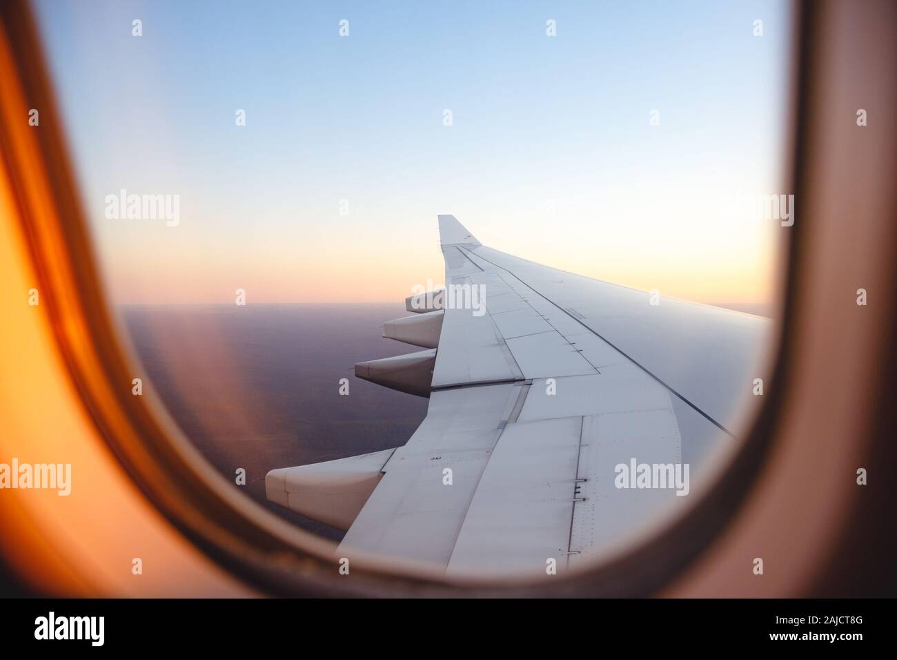 Passenger seat view during sunset Stock Photo - Alamy